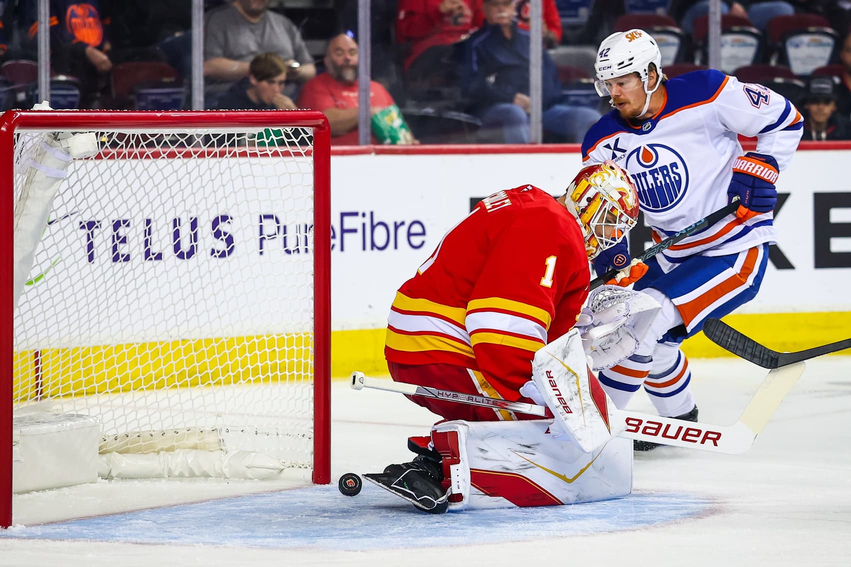 Road teams prevail in both split-squad games between Oilers and Flames ...